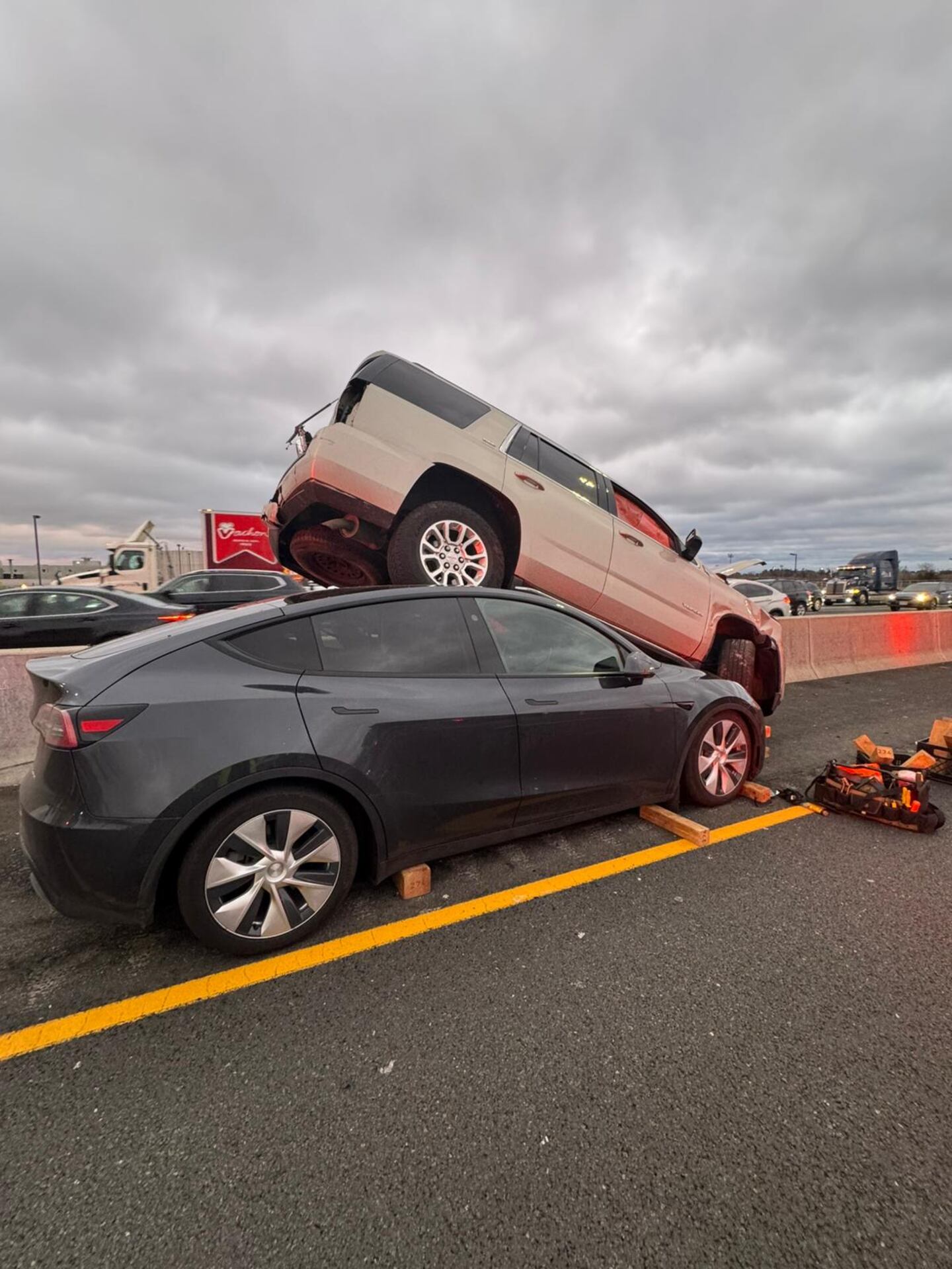 SUV lands on top of Tesla following crash on Burlington QEW